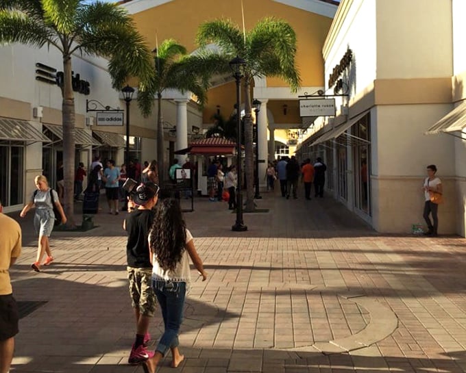 Strolling these sun-drenched walkways between stores feels distinctly Floridian—part vacation, part mission, all air-conditioned salvation from the Orlando heat.