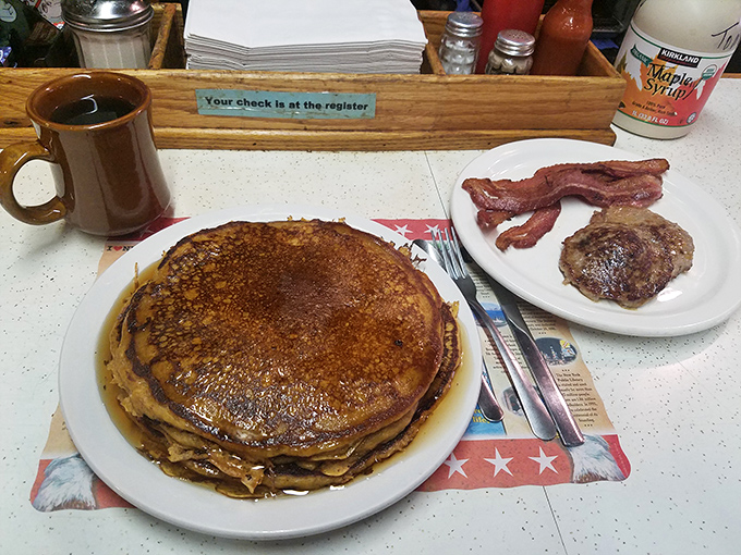 Pancakes so perfectly golden they deserve their own Ohio state flag, flanked by bacon that's achieved that magical balance between crisp and chewy.