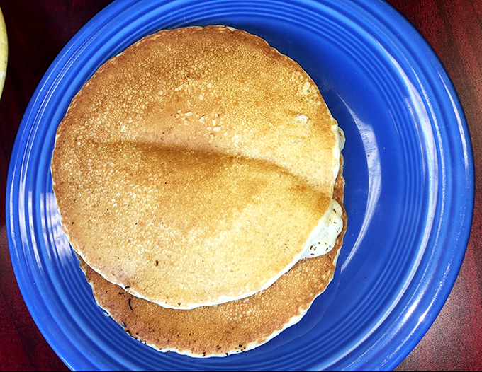 Golden pancakes that look like they were kissed by the sun gods. Perfectly round, perfectly browned, perfectly stacked &ndash; breakfast geometry at its most delicious.