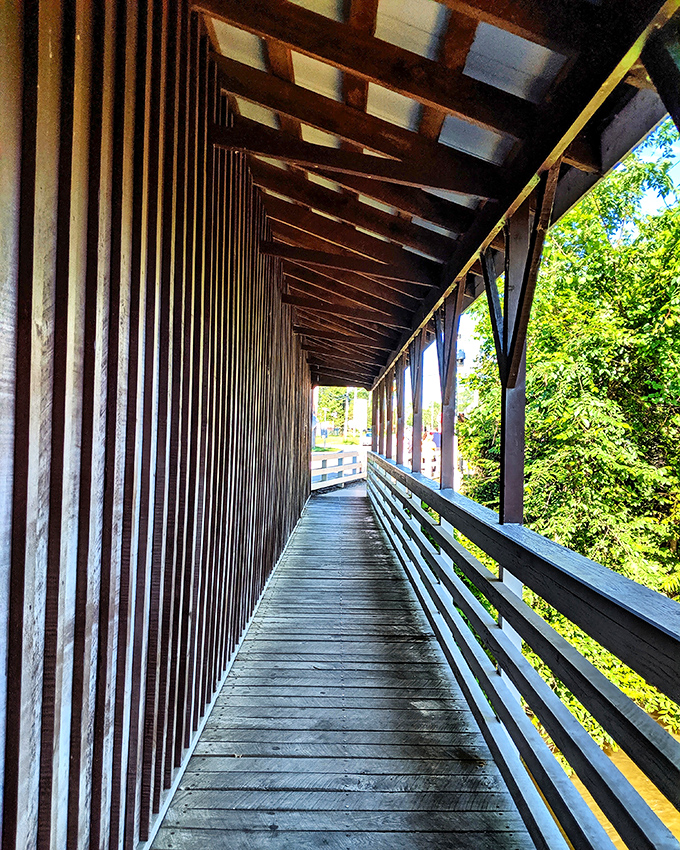 Walking through this wooden corridor feels like stepping into a sepia photograph – minus the stiff collars and impossibly long exposure times.