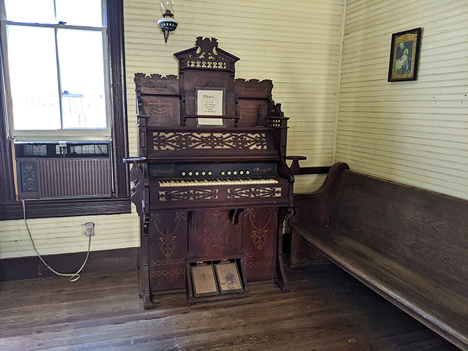 This ornate pump organ sits patiently, waiting for someone to bring it back to life. Sunday hymns and parlor entertainment before Netflix existed.