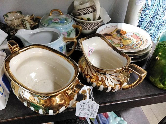 Delicate gold-trimmed creamers and sugar bowls await their next tea party. Grandmother would approve, though she'd wonder why you're paying for what she got as a wedding gift. 