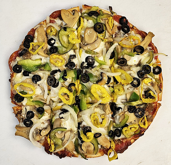 Veggie pizza that makes eating your greens feel like cheating on your diet. Those banana peppers aren't just toppings; they're conversation starters.