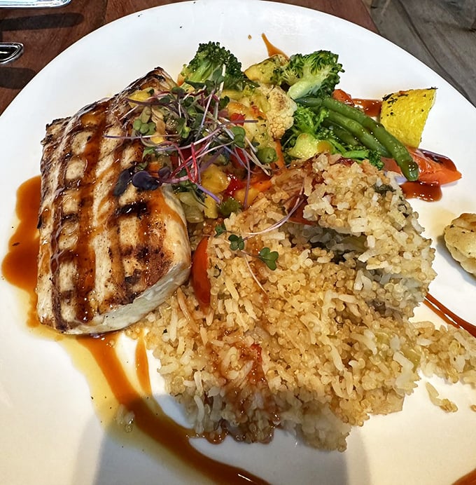 Perfectly grilled fish meets colorful vegetables and fluffy rice&mdash;proof that sometimes the simplest preparations let the ocean's bounty truly shine.