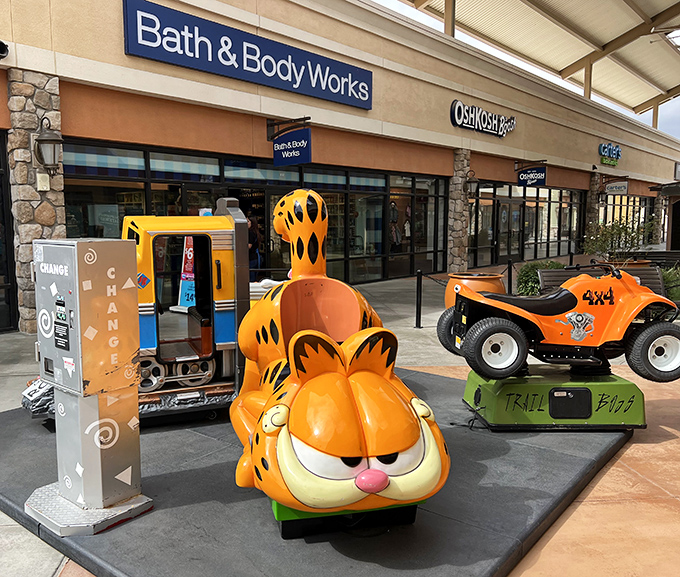 Garfield rides shotgun on kiddie adventures, proving that shopping therapy works for every age and cartoon preference.