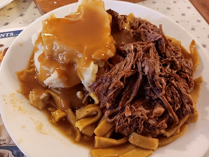 Pot roast so tender it surrenders at the mere sight of your fork, swimming in gravy that deserves its own fan club.