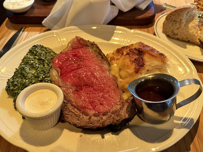 Behold the star of the show: prime rib so perfectly pink it makes other cuts jealous, flanked by creamed spinach and potatoes like loyal courtiers.