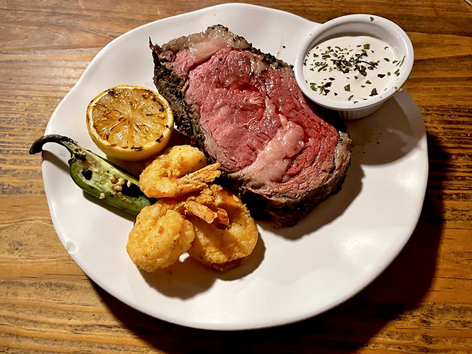 A perfectly cooked prime rib that makes you wonder if you've been eating meat wrong your entire life. That rosy center speaks volumes.