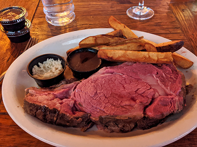 The star of the show: prime rib cooked to perfection. That rosy interior and seasoned crust is what food dreams are made of.