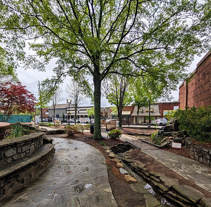 Nature and stonework dance together in this peaceful garden retreat, proving that even historic towns need a quiet spot for contemplation. 