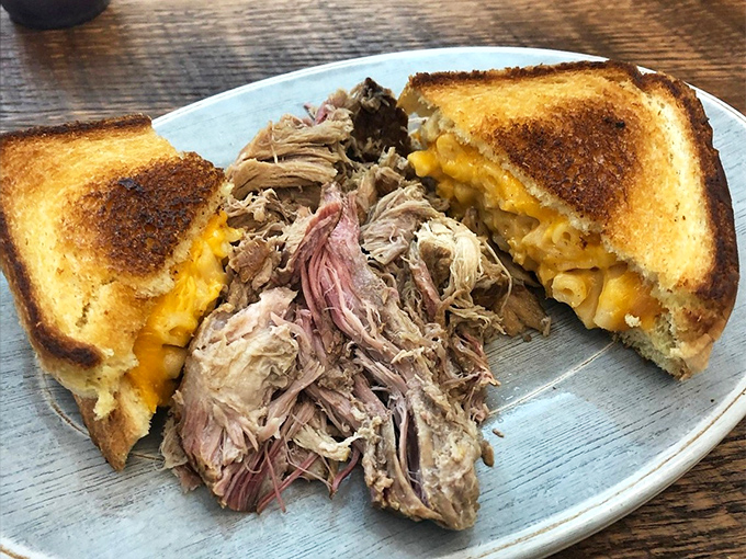 Pulled pork that practically surrenders at the sight of your fork, paired with mac and cheese that's clearly been living its best life.
