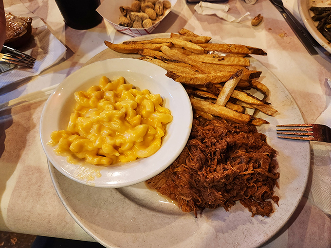 Pulled pork that surrenders at the mere sight of a fork, paired with creamy mac and cheese that would make your grandmother jealous.