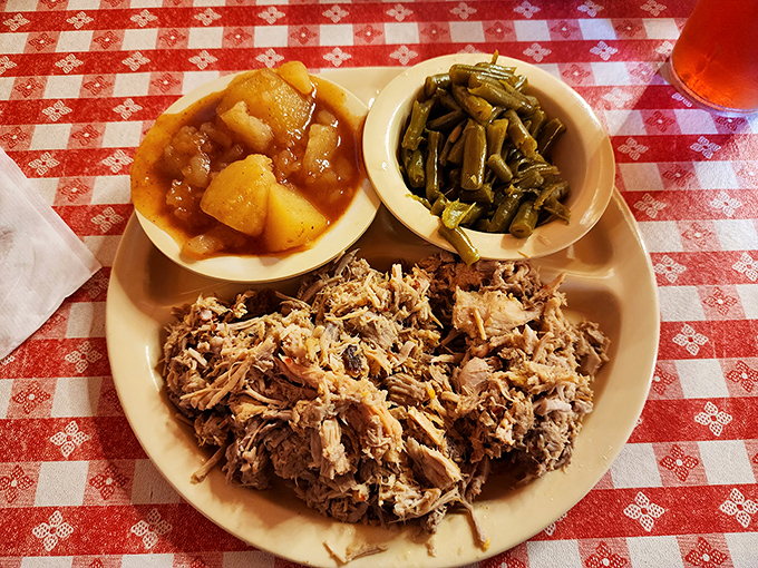 Behold the Eastern NC barbecue plate in all its glory&mdash;chopped pork with that vinegar tang, Brunswick stew, and collards. Heaven on a humble plate.