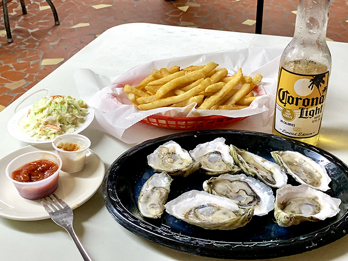 Fresh oysters arrive like little ocean jewels, each one a briny kiss from the Gulf.
