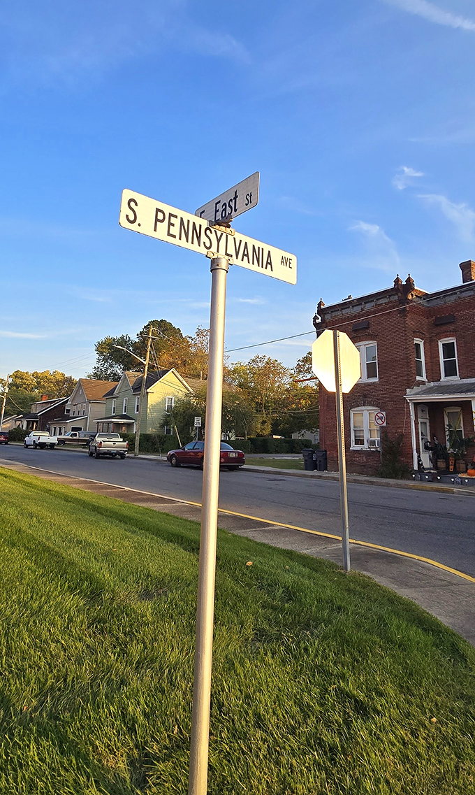 Street signs at the intersection of Affordable and Charming, where neighbors still wave and nobody's competing for parking spots.