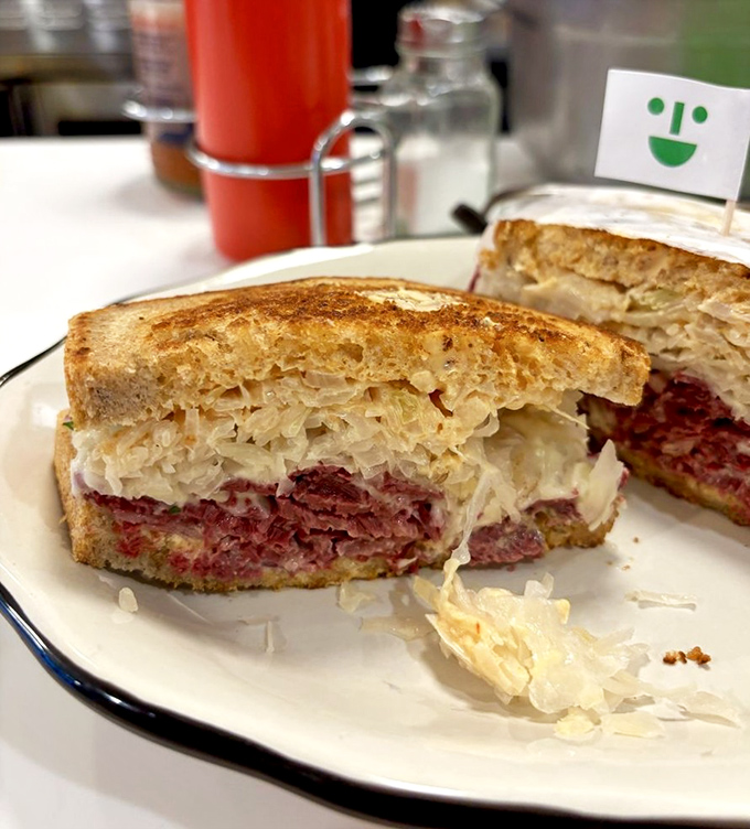 The legendary Reuben in all its glory&mdash;perfectly stacked corned beef, tangy sauerkraut, and melted Swiss creating a symphony of flavors between toasted bread.