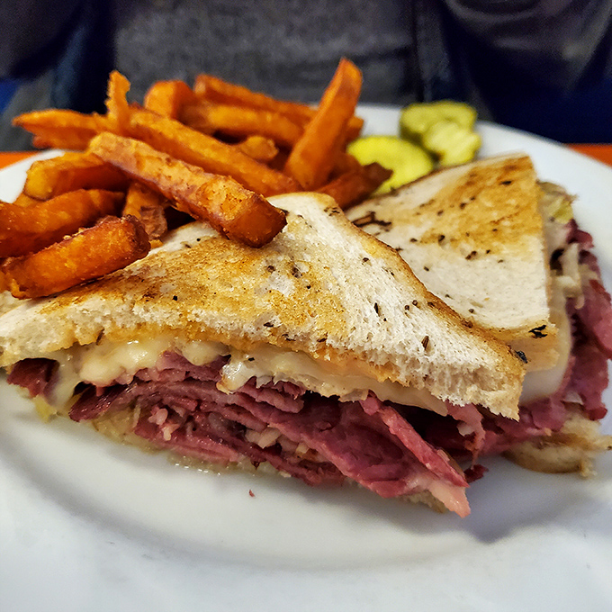 This Reuben isn't just a sandwich&mdash;it's architecture. Layers of corned beef and melted cheese creating a savory skyscraper of flavor.