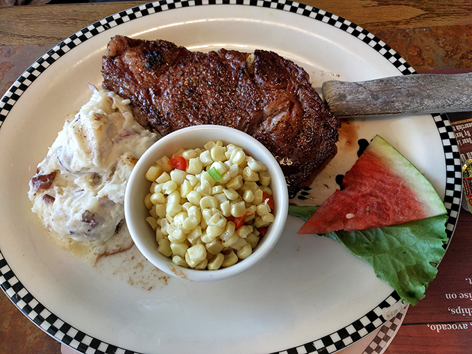 This isn't just a steak; it's a carnivore's dream vacation with sides acting as delightful travel companions on your plate.