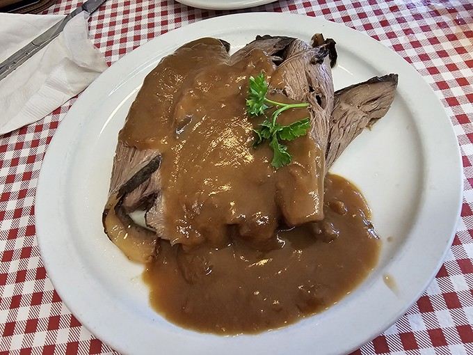This roast beef arrives swimming in gravy so rich, your cardiologist might faint but your taste buds will sing.