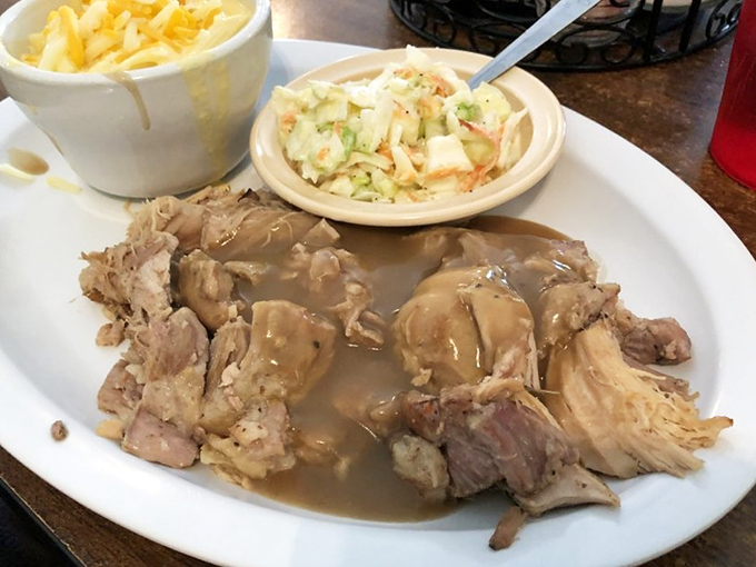 Fork-tender roast pork swimming in savory gravy. The kind of meal that makes you want to call your mother and apologize for ever complaining about her cooking.