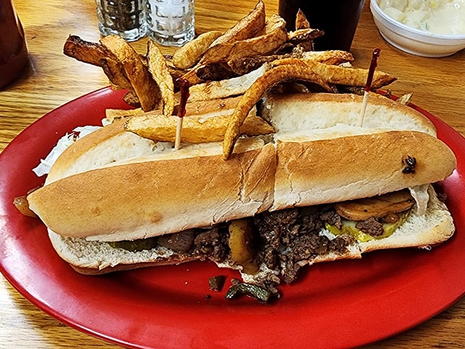 This cheesesteak sandwich isn't messing around—packed with savory meat and served with golden hand-cut fries. The kind of meal that makes you want to high-five the chef.