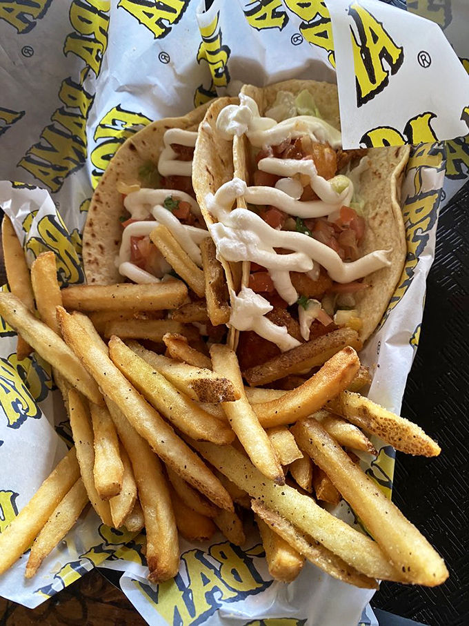 These aren't just tacos; they're edible postcards from paradise. Golden fries and seafood wrapped in tortillas &ndash; vacation on a plate.