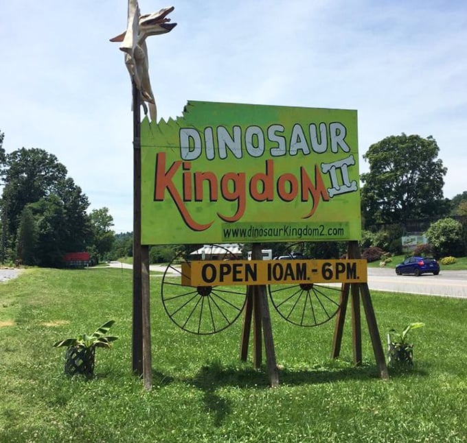 The roadside sign announces operating hours with prehistoric flair &ndash; your first clue this isn't your average historical attraction.