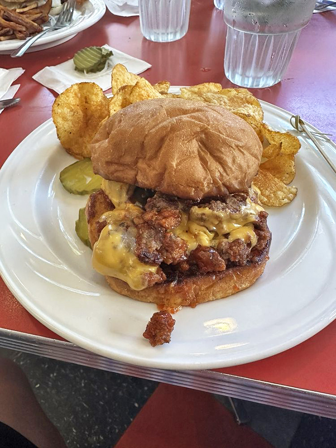 The Sloppy Burger doesn't care about your shirt's cleanliness. This magnificent mess of melted cheese and seasoned beef demands your full attention&mdash;and possibly an extra napkin.