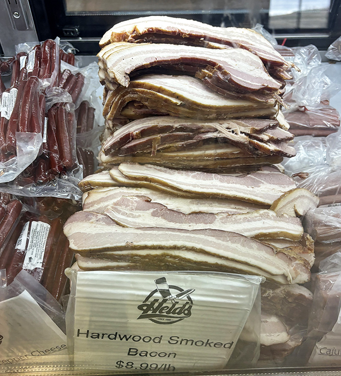 Bacon stacked like gold bars in Fort Knox. This hardwood-smoked treasure makes grocery store versions look like sad imitations.