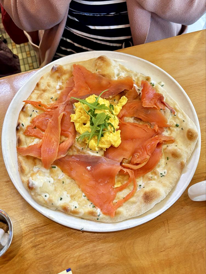 Breakfast pizza reinvented: smoked salmon and scrambled eggs atop a perfectly blistered crust. Morning glory on a plate that makes cereal seem like cruel punishment.