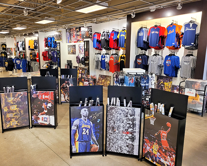 Sports memorabilia that lets you bring home a piece of the game. Basketball legends watch over t-shirts that transform fans into walking tributes.