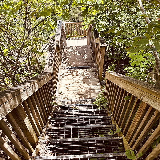 These wooden steps descend into paradise, though your legs might have different opinions about the return trip.