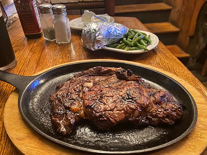 This isn't just a steak &ndash; it's a masterpiece of marbling and char, sizzling dramatically on cast iron like a meaty meteor that landed perfectly on your table.