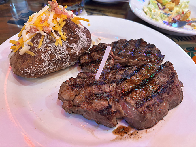 A perfectly grilled steak with a loaded baked potato—proof that sometimes the simplest pleasures are the most profound. Michelin stars are overrated anyway.