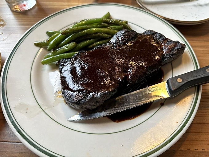 A perfectly seared steak that doesn't need a passport to transport you to heaven. Those green beans aren't just sidekicks&mdash;they're worthy companions.