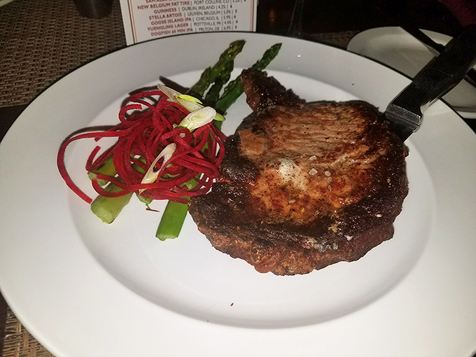 This isn't just a steak; it's a masterpiece with grill marks so perfect they could hang in an art gallery. The asparagus is just showing off.