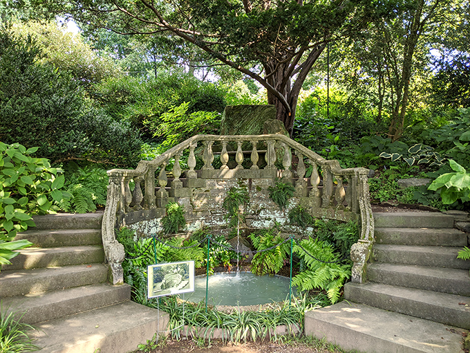 Hidden garden nooks like this make you wonder if you've stumbled into a secret society's meeting place. The stone balustrade whispers tales of garden parties past.