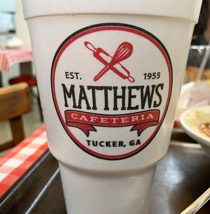 That's not just any styrofoam cup&mdash;it's a vessel of sweet tea magic, proudly displaying the Matthews logo like a badge of Southern honor.