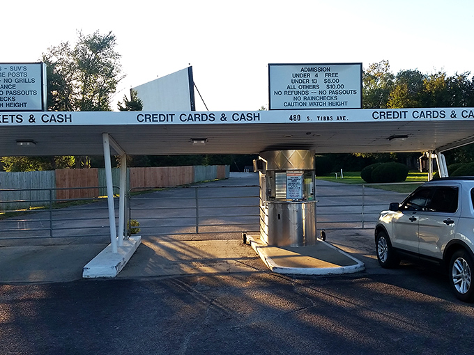 Gateway to nostalgia: the ticket booth where modern life pauses and simpler pleasures begin. Cash or card, memories are priceless.