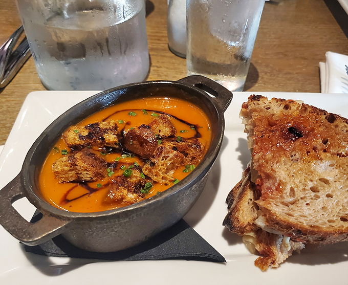 This isn't just tomato soup; it's a sunset in a cast-iron bowl, complete with perfectly toasted bread for necessary dipping operations.