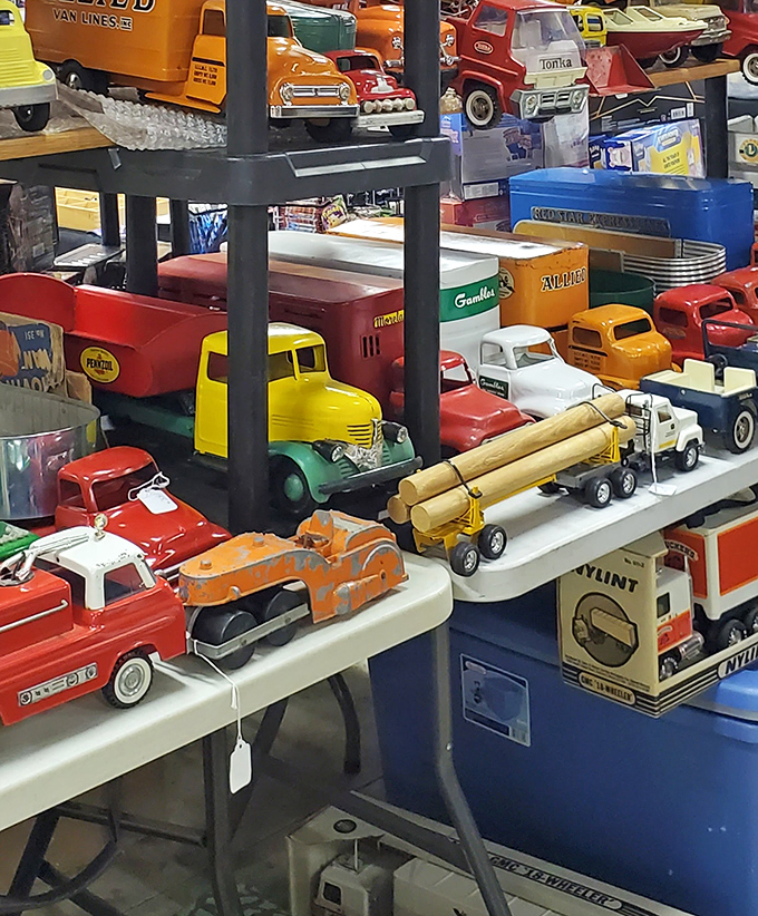 Vintage toy trucks lined up like a parade from childhood memories. Each tiny vehicle carries a cargo of nostalgia worth more than gold.