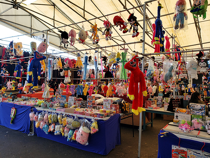 Plush paradise! A colorful army of stuffed companions dangles overhead, each one silently pleading, "Take me home!" to passing shoppers.