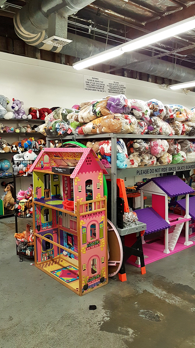 Dollhouses waiting for new families to imagine stories within their plastic walls, while stuffed animals pile high in hopeful anticipation.