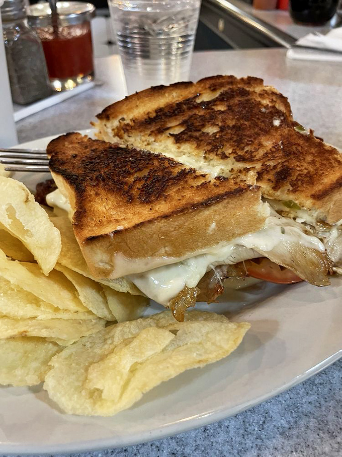 This turkey melt doesn't need Instagram filters&mdash;golden, crispy bread barely containing the melty cheese rebellion within. Worth every napkin.