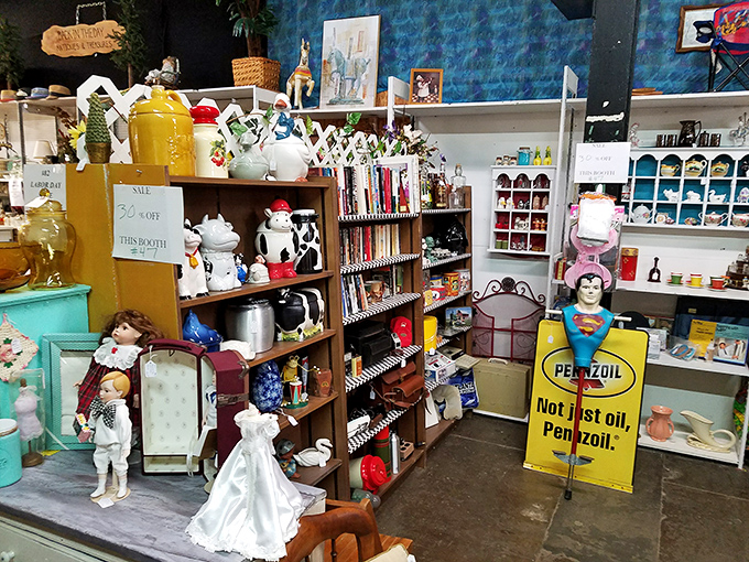 Cookie jars, collectibles, and childhood memories line these shelves. That Pennzoil sign would look perfect in my brother-in-law's garage!