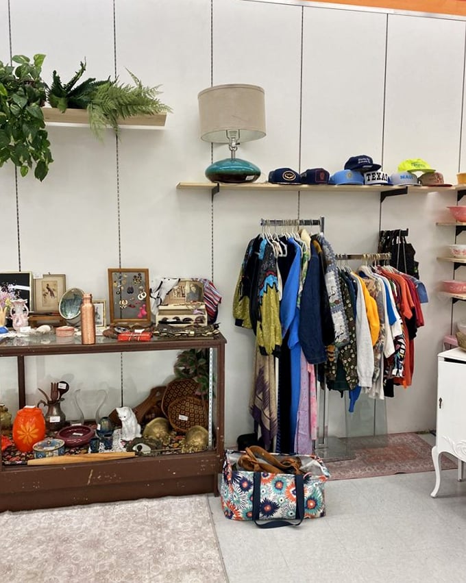 A perfectly curated corner where vintage clothing meets collectibles &ndash; someone's memories becoming another person's newfound treasures.
