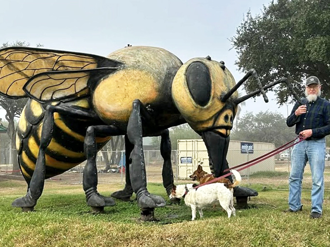 Even four-legged visitors seem unfazed by this giant buzzer. Dogs and humans alike find the massive monument more fascinating than frightening.