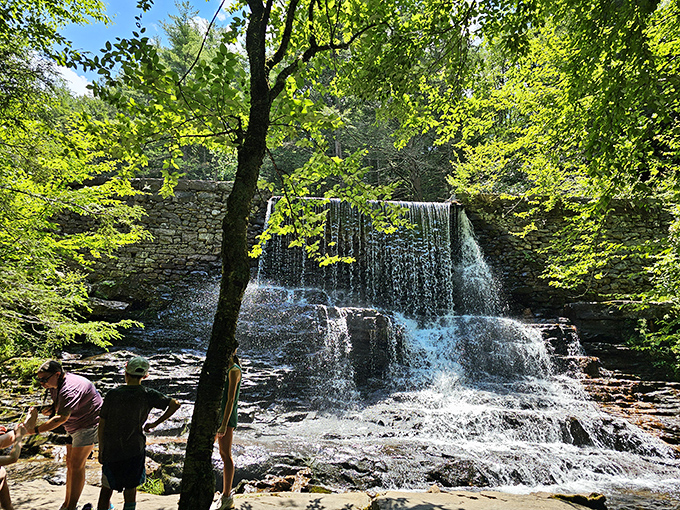 Sunlight dances through the mist at this multi-tiered waterfall. The perfect spot to contemplate life's big questions or just enjoy nature's shower show.