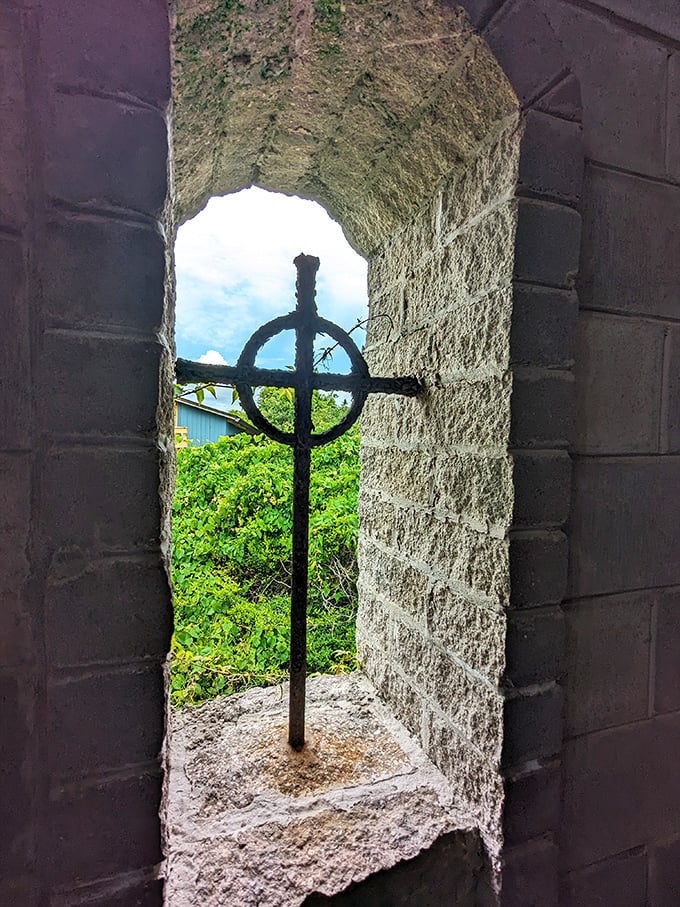 A Celtic cross framed by stone, this window offers more than a view&mdash;it's a portal between Florida's sunshine and Ireland's ancient spiritual traditions.