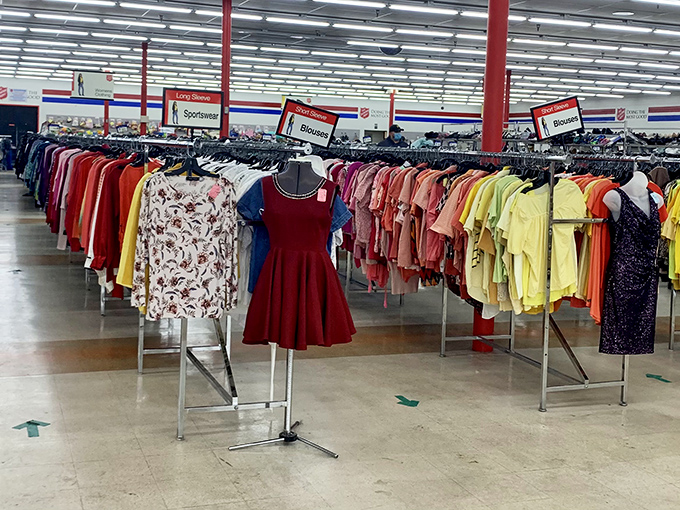 Colorful dresses hang like a rainbow of second chances, each one waiting for its next special occasion moment.